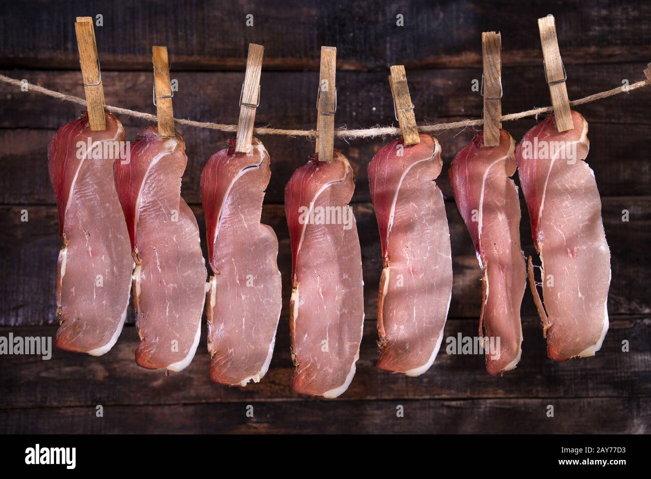 Smoked bacon hanging Stock Photo - Alamy