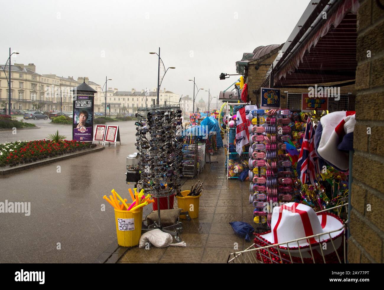 Heavy torrential rain downpour on a seaside tourist shop Stock Photo ...