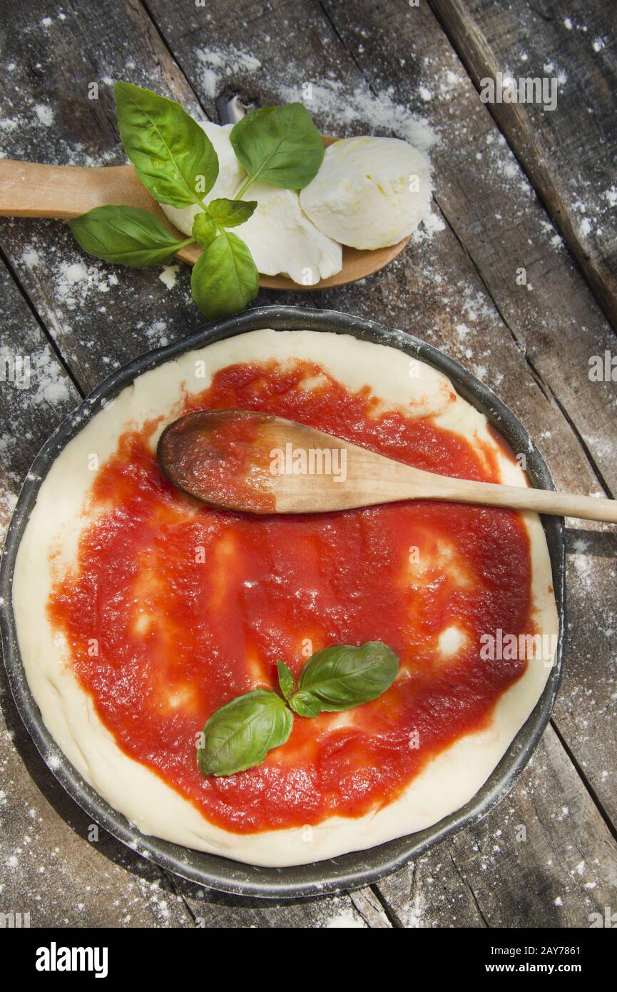 Raw pizza base Stock Photo - Alamy