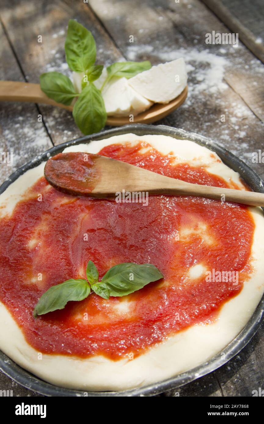 Raw pizza base Stock Photo - Alamy