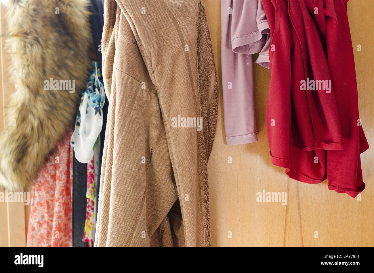 Pile of carelessly scattered clothes in wardrobe Stock Photo - Alamy