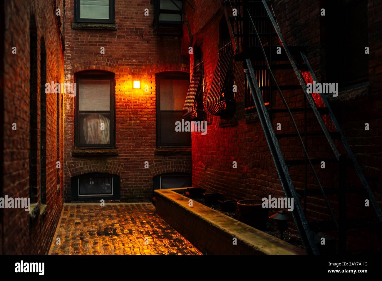 A dark creepy narrow boston alley at night Stock Photo - Alamy
