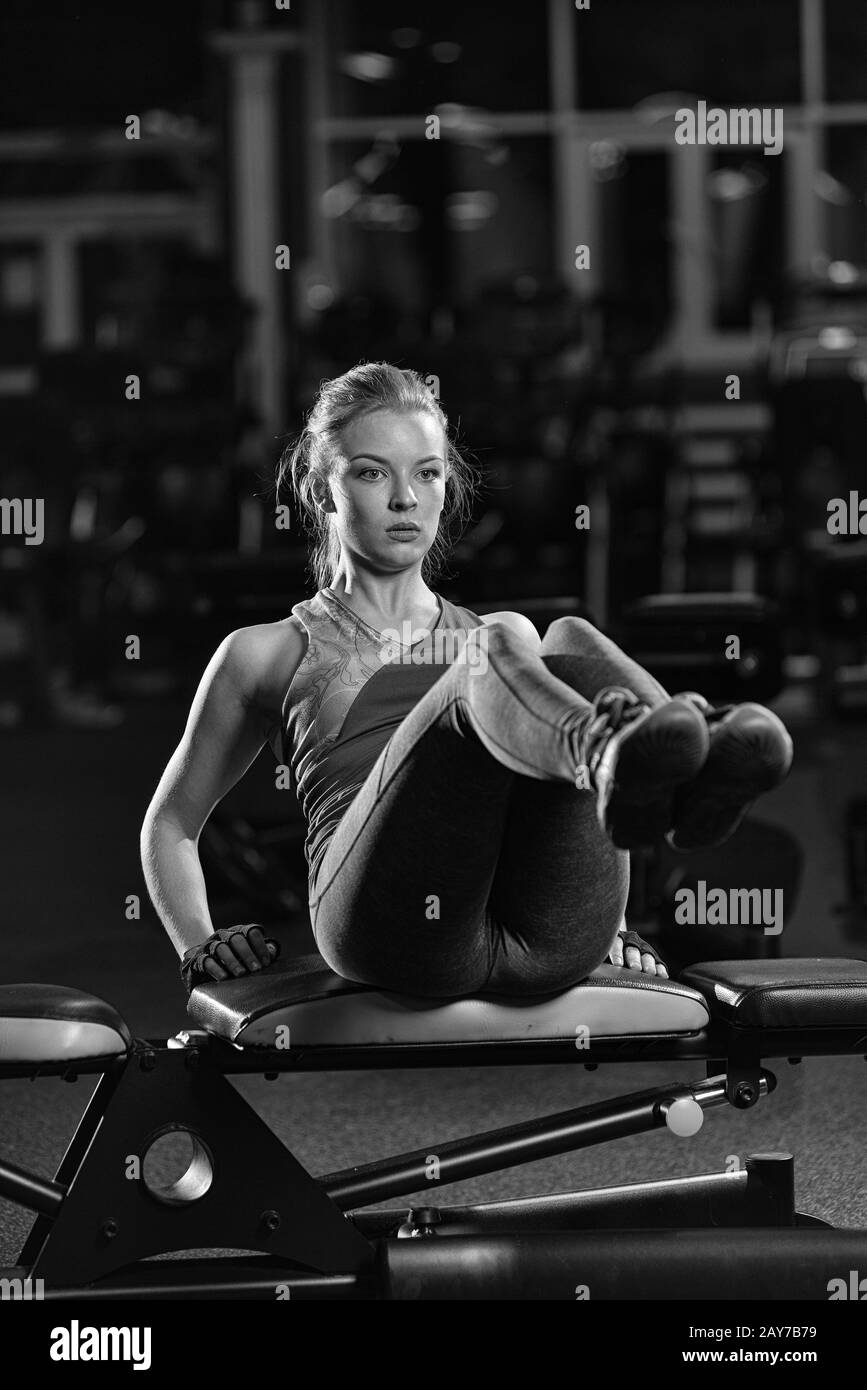 Woman doing strength exercises for abs muscles Stock Photo - Alamy