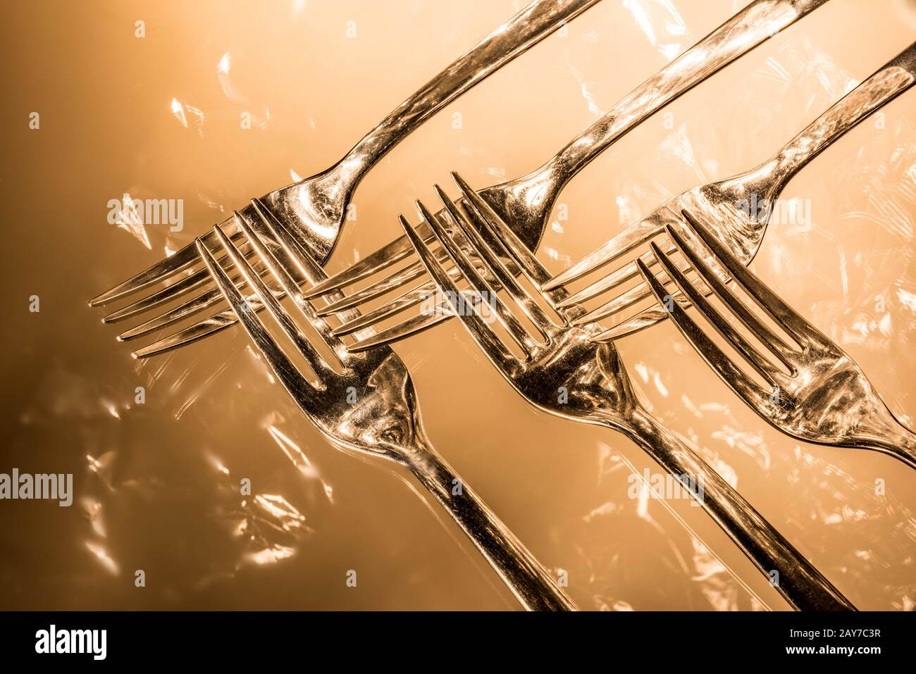 Fork, spoon and knife with reflections and light effects Stock Photo ...