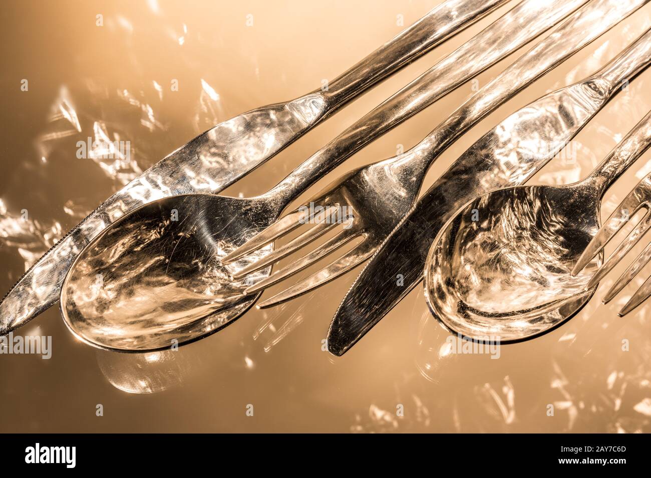 Fork, spoon and knife with reflections and light effects Stock Photo ...