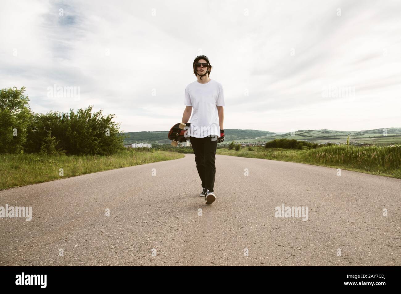 Man walking with helmet hi-res stock photography and images - Alamy