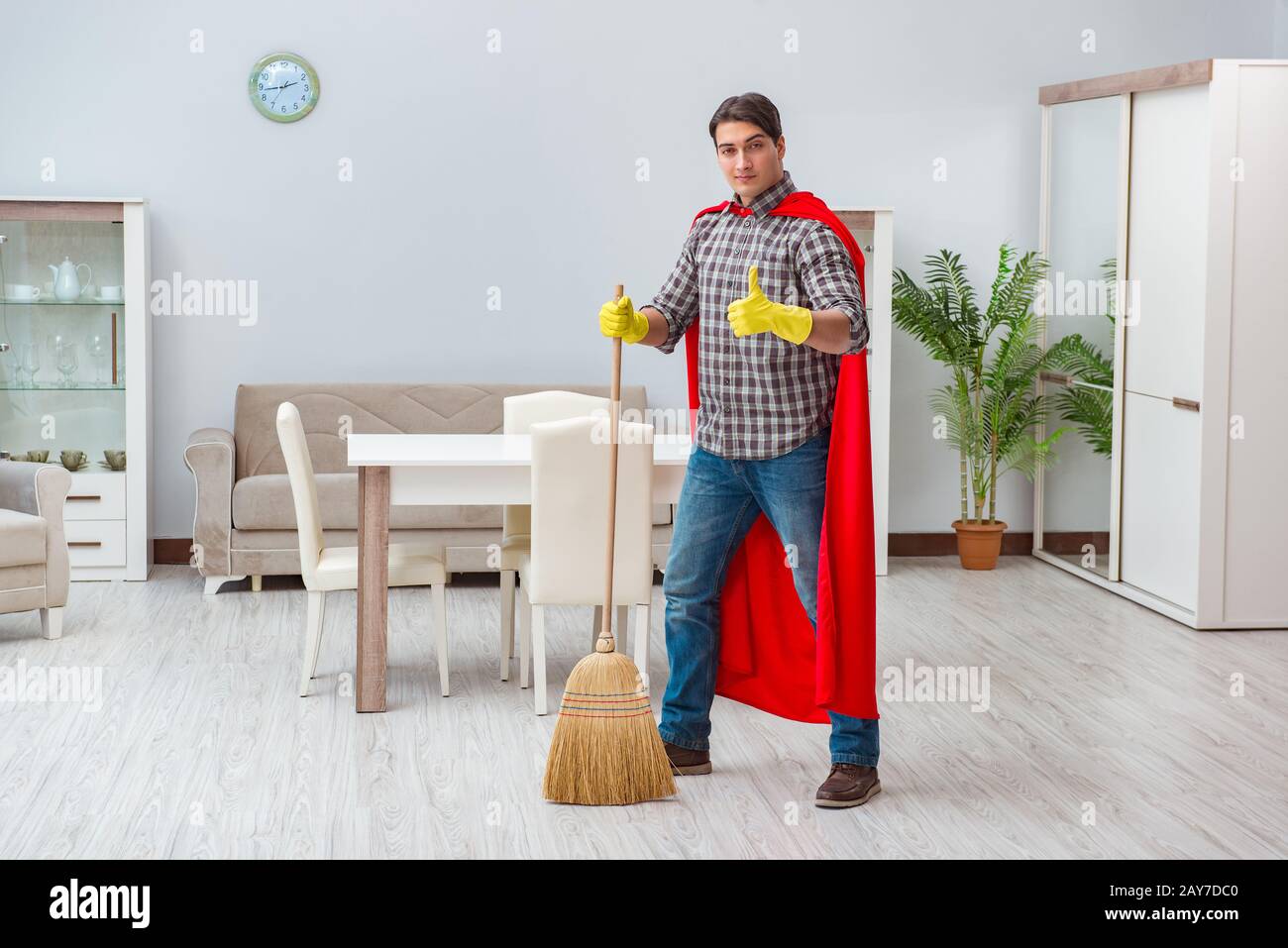 Super hero cleaner working at home Stock Photo - Alamy