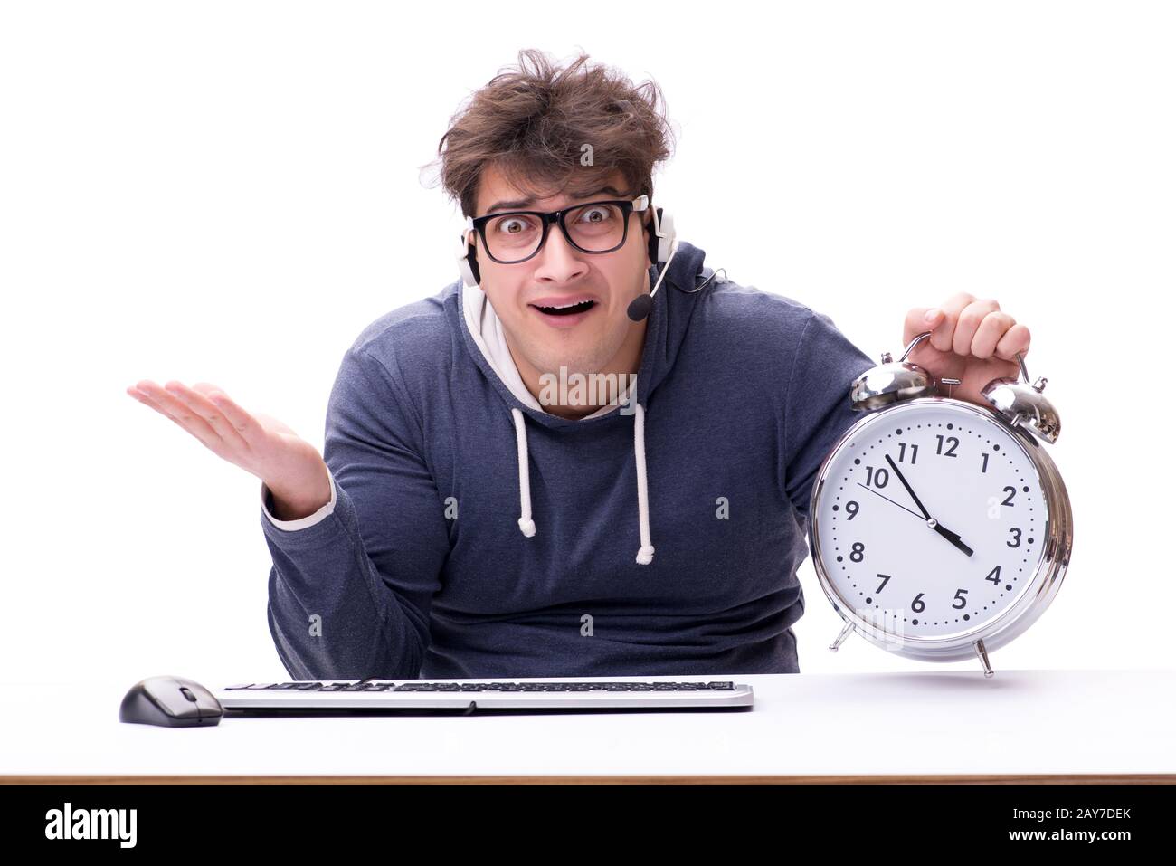 Funny nerd call center operator with giant clock Stock Photo - Alamy