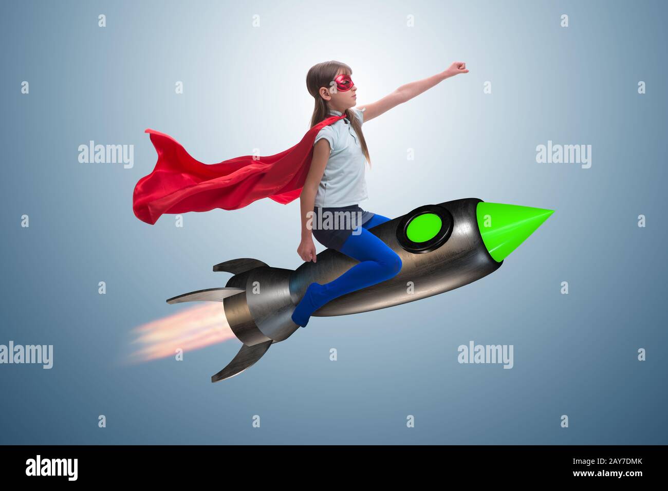 Little girl flying rocket in superhero concept Stock Photo - Alamy