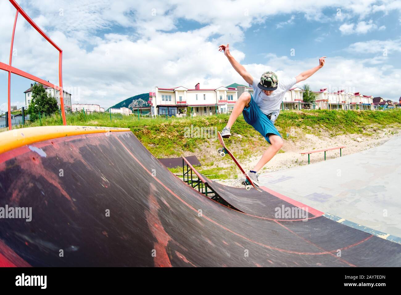 Young boy doing the trick on the ramp Stock Photo - Alamy