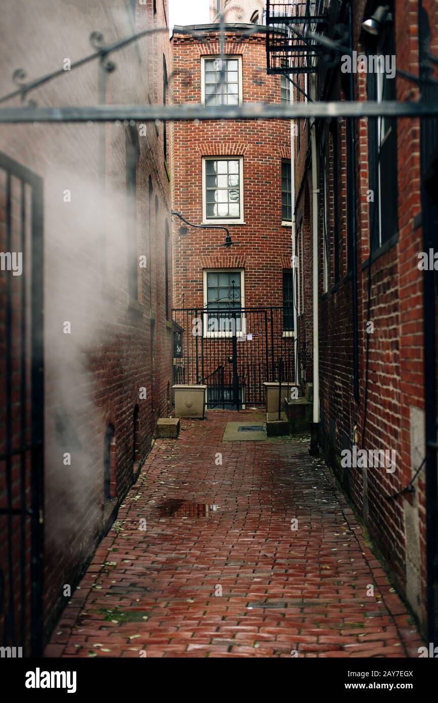 A dark creepy narrow boston alley Stock Photo - Alamy
