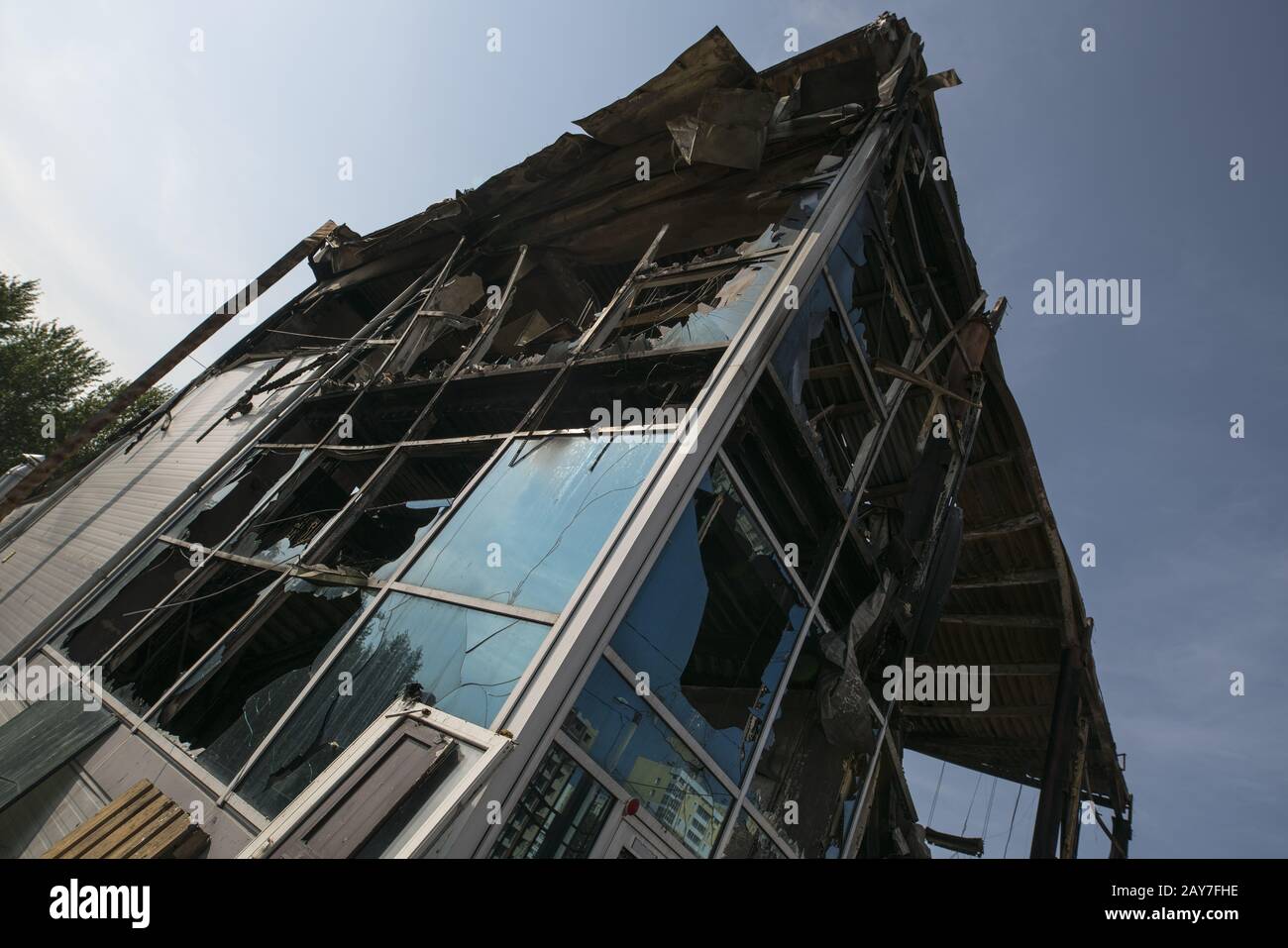 Burned building with broken windows in summer Stock Photo - Alamy