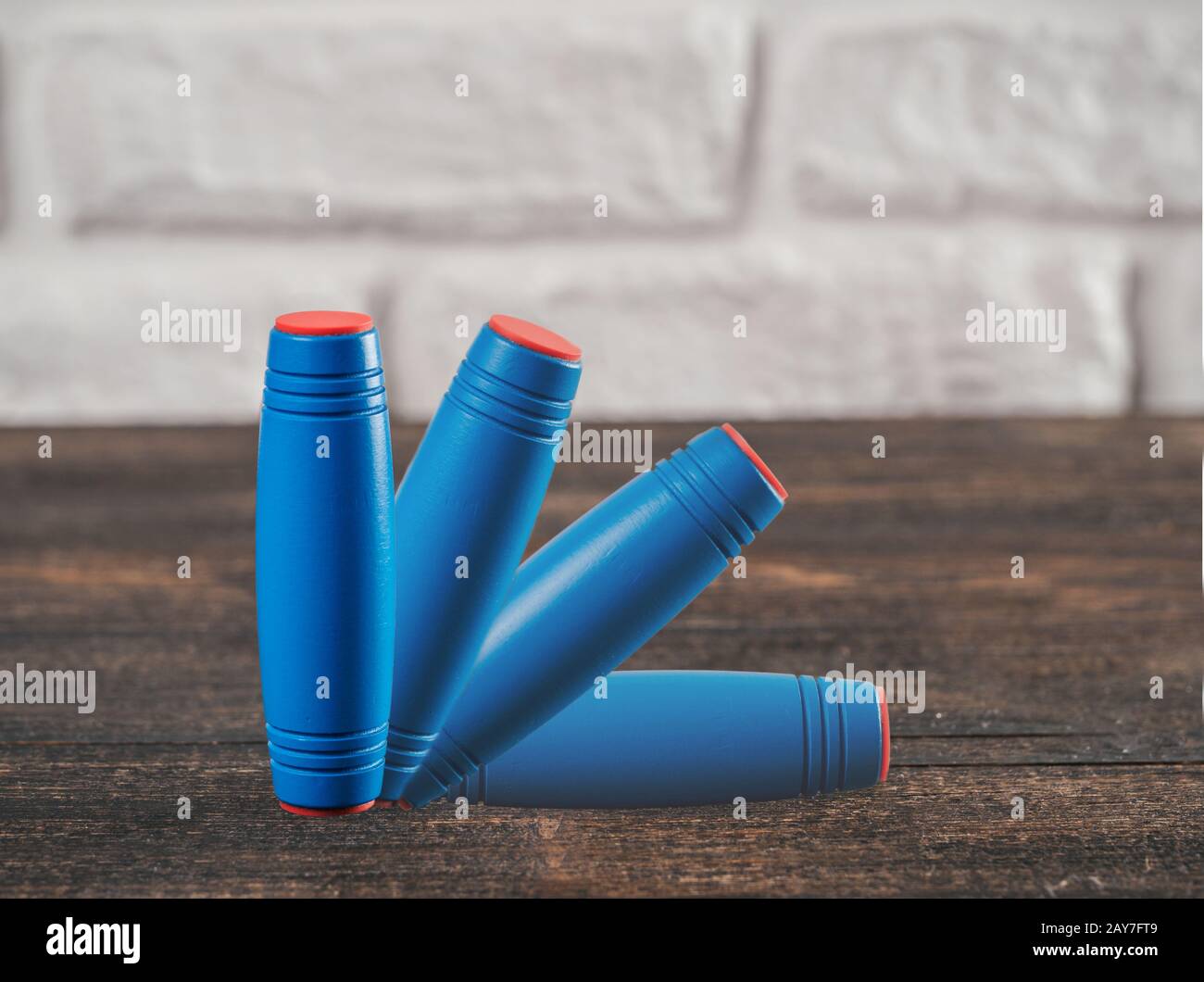 fidget rolling stick toy flip blue color isolated Stock Photo - Alamy
