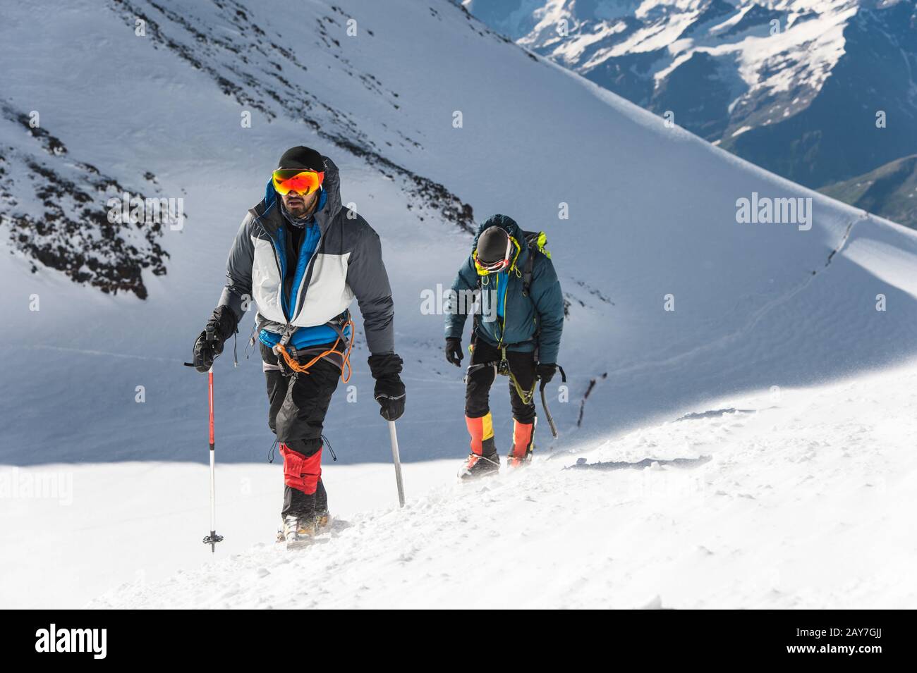 Two professional climbers go to the western peak of Elbrus Stock Photo ...