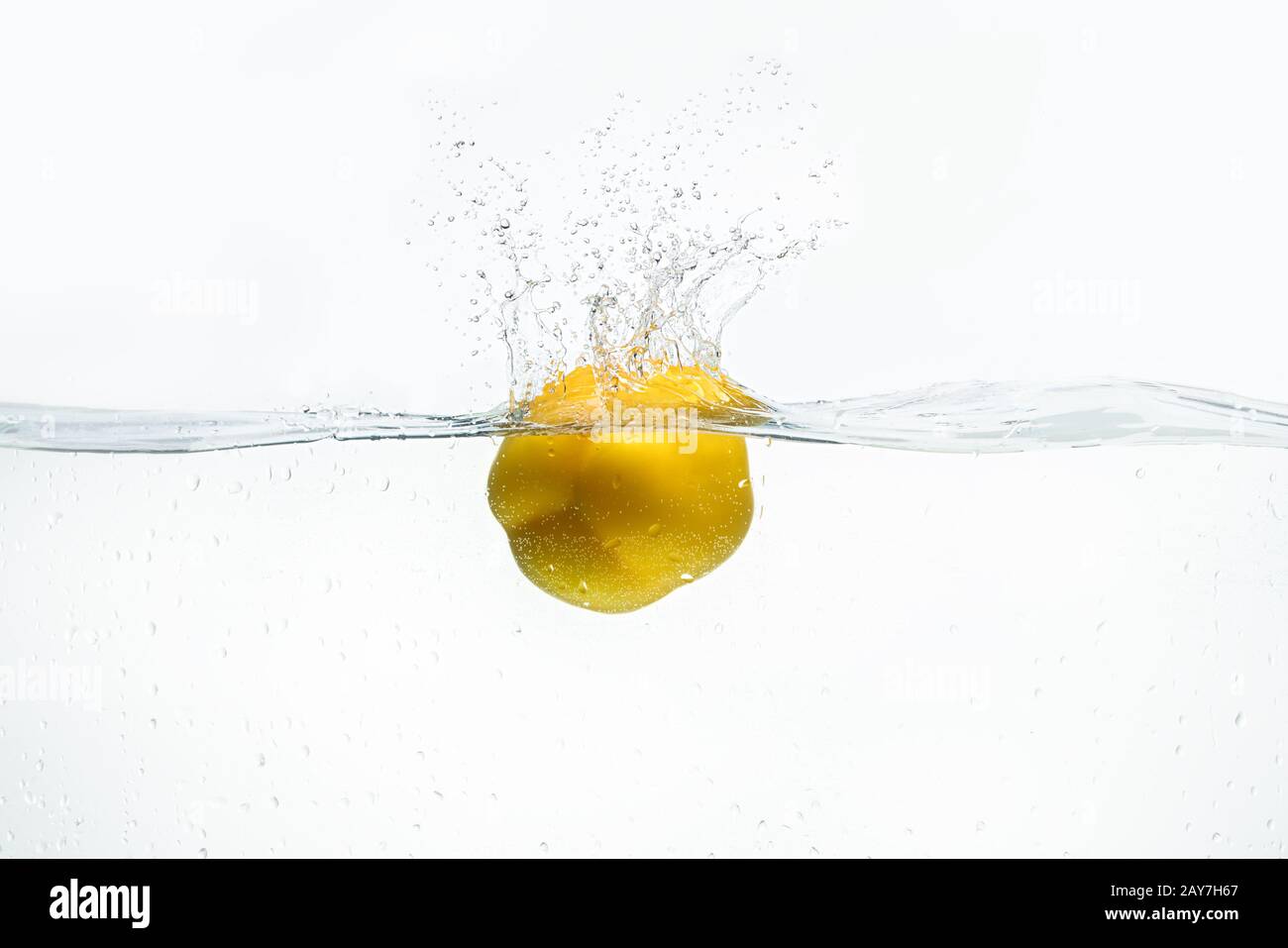 Lemon being dropped into water isolated on white Stock Photo - Alamy