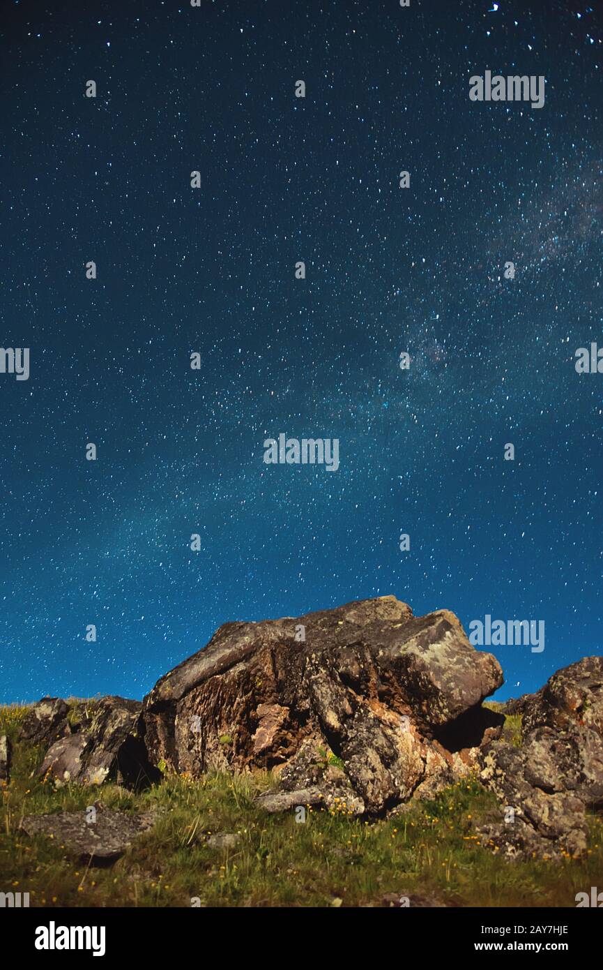 A large rock against the Milky Way Stock Photo - Alamy