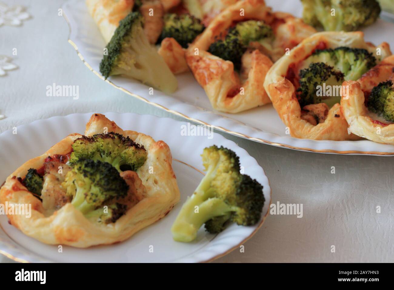 A delicious and tasty snack. Puff pastry with broccoli and cheese ...