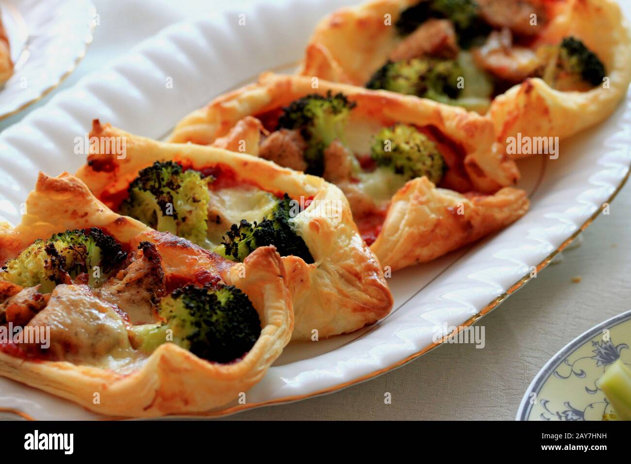 A delicious and tasty snack. Puff pastry with broccoli and cheese ...