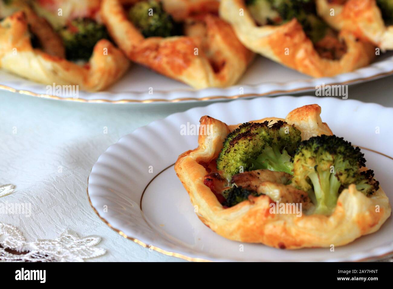 A delicious and tasty snack. Puff pastry with broccoli and cheese ...