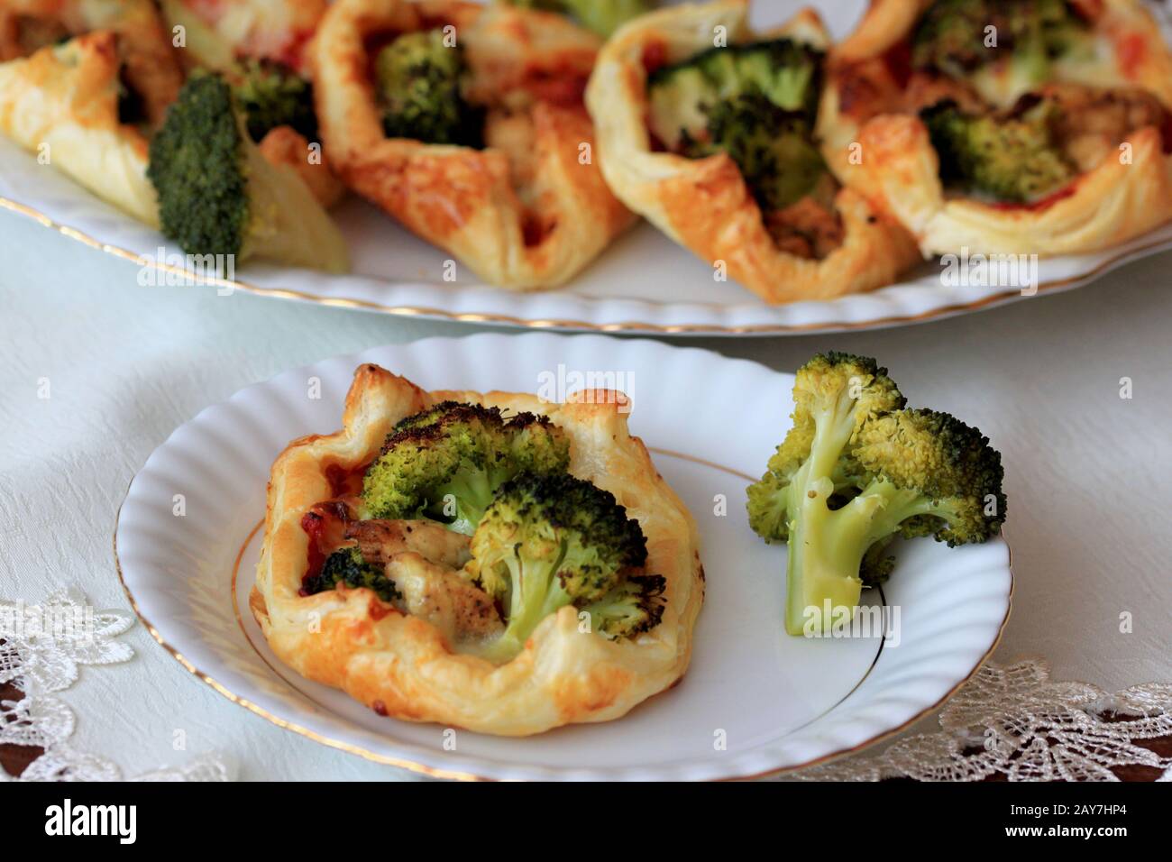 A delicious and tasty snack. Puff pastry with broccoli and cheese ...
