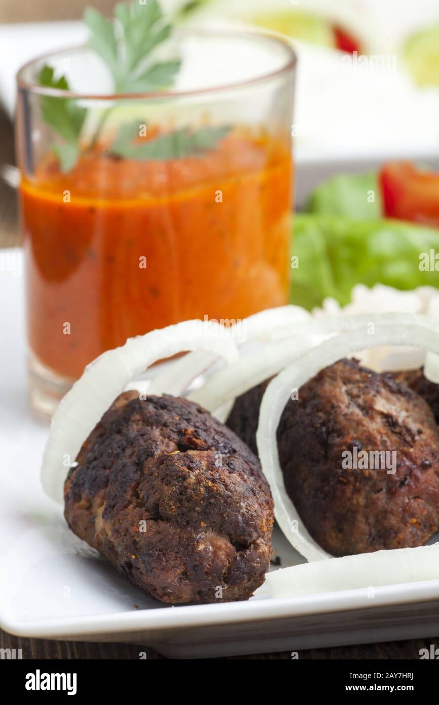 Grilled cevapcici with ajvar Stock Photo - Alamy