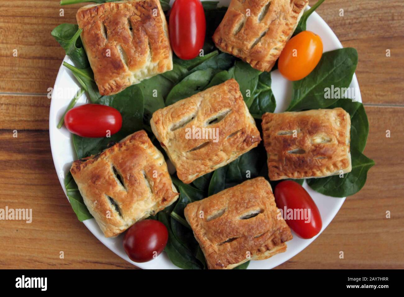 French pastry with spinach. Stuffed puff pastry. A tasty snack. Puff ...