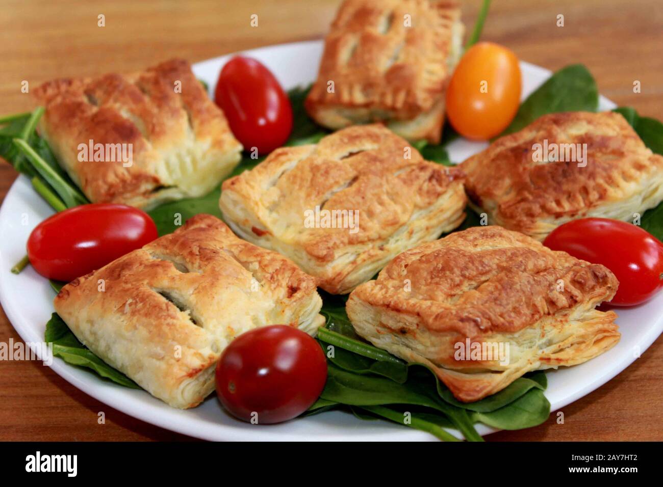 French pastry with spinach. Stuffed puff pastry. A tasty snack. Puff ...
