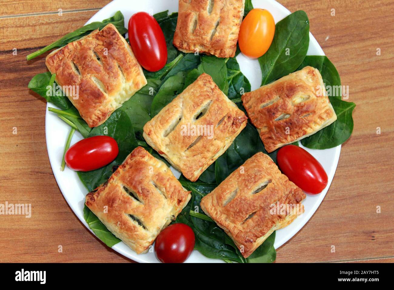 French pastry with spinach. Stuffed puff pastry. A tasty snack. Puff ...
