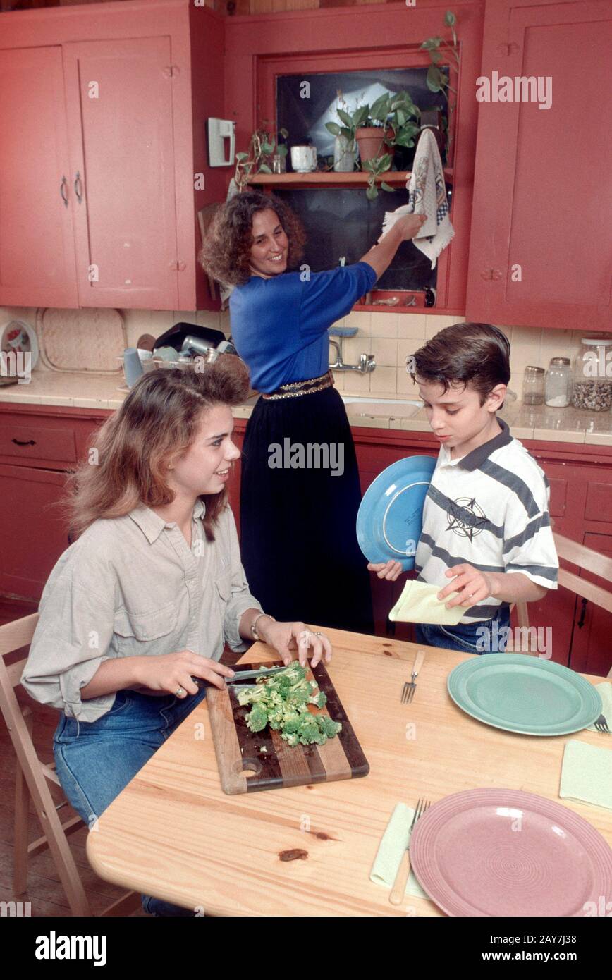 Single mom and kids prepare dinner at home. ©Bob Daemmrich Stock Photo ...