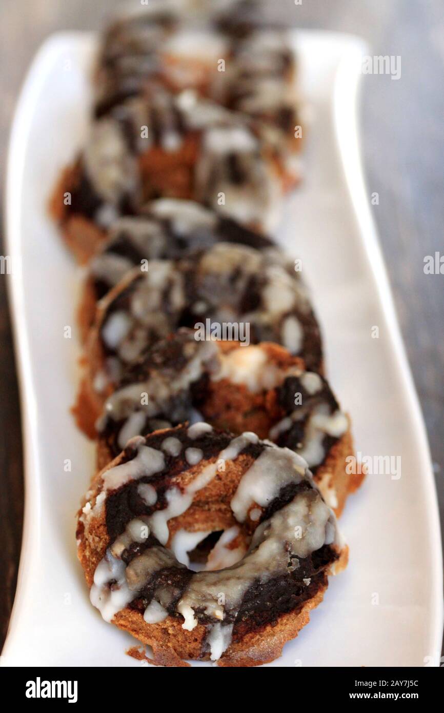 Cinnamon packets with a hole. American donuts. Baked Doughnuts ...