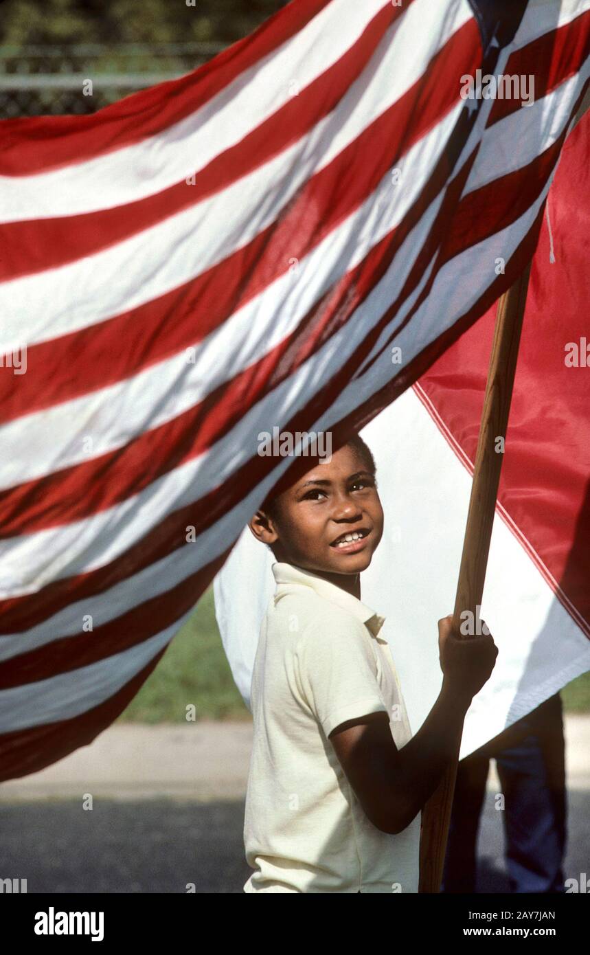 Austin, Texas: Boy with American flag at Juneteenth celebration, Black ...