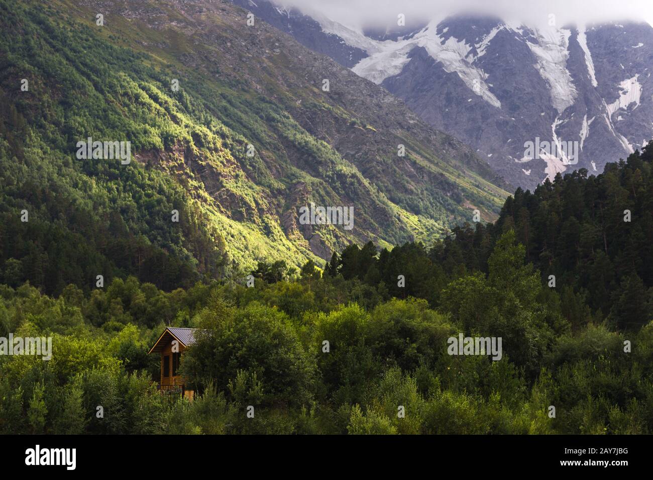 Vertical landscape, the sunlight breaking through the clouds locally ...