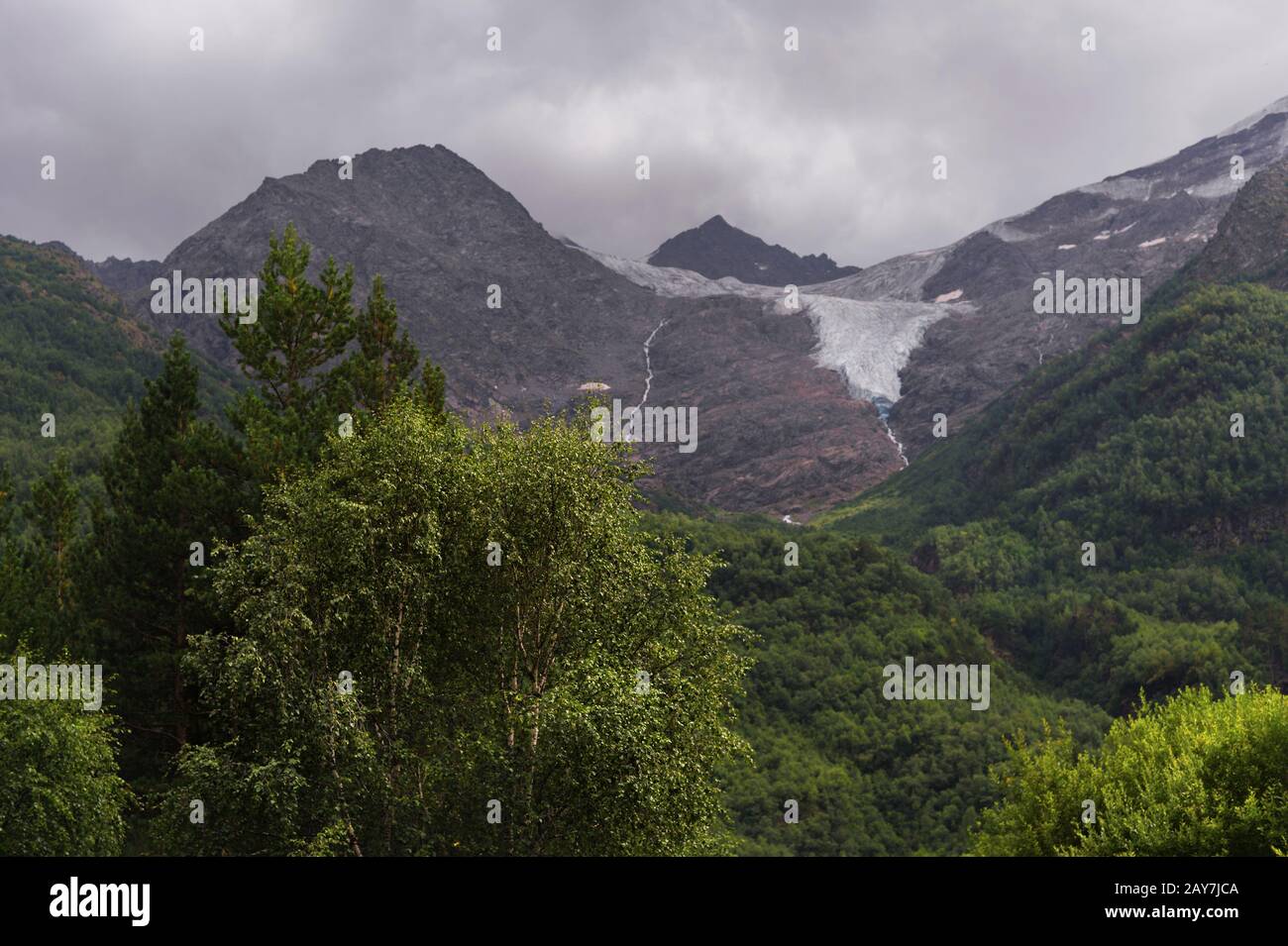Vertical landscape, the sunlight breaking through the clouds locally ...