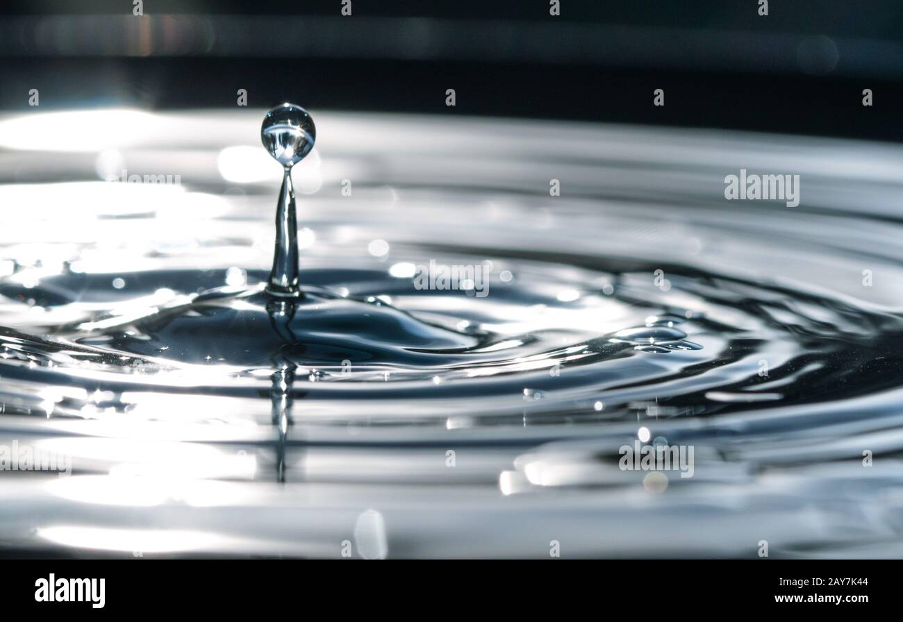 Water Drop splash with sun Stock Photo - Alamy