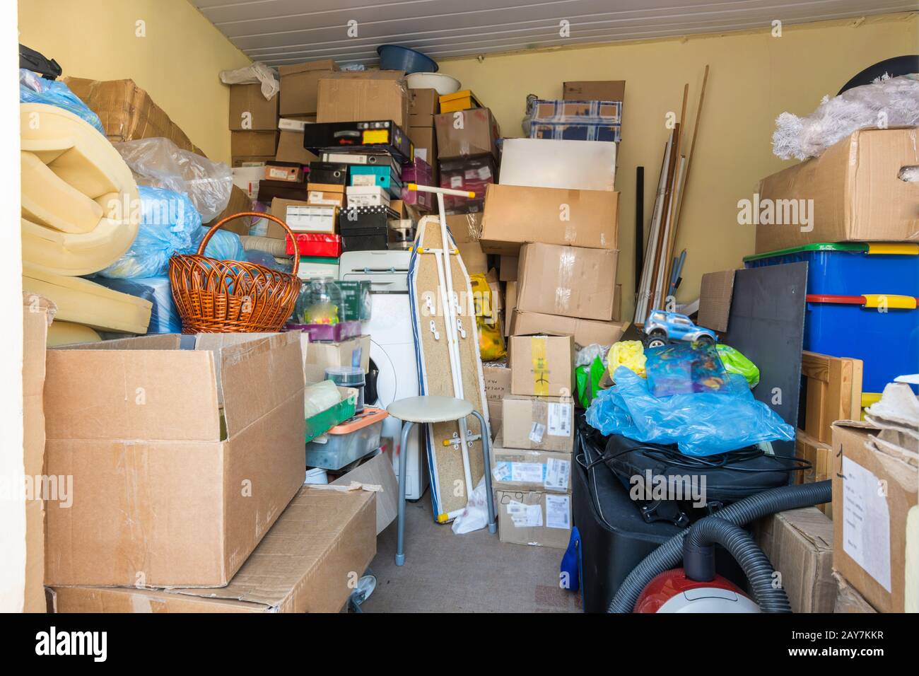 Moving, things packed in boxes and packages lie in a small room Stock ...