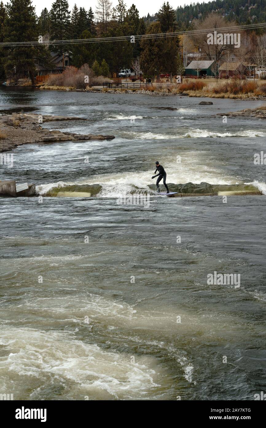 River surfing in the Deschutes River at the Bend White Water Rapid Park ...