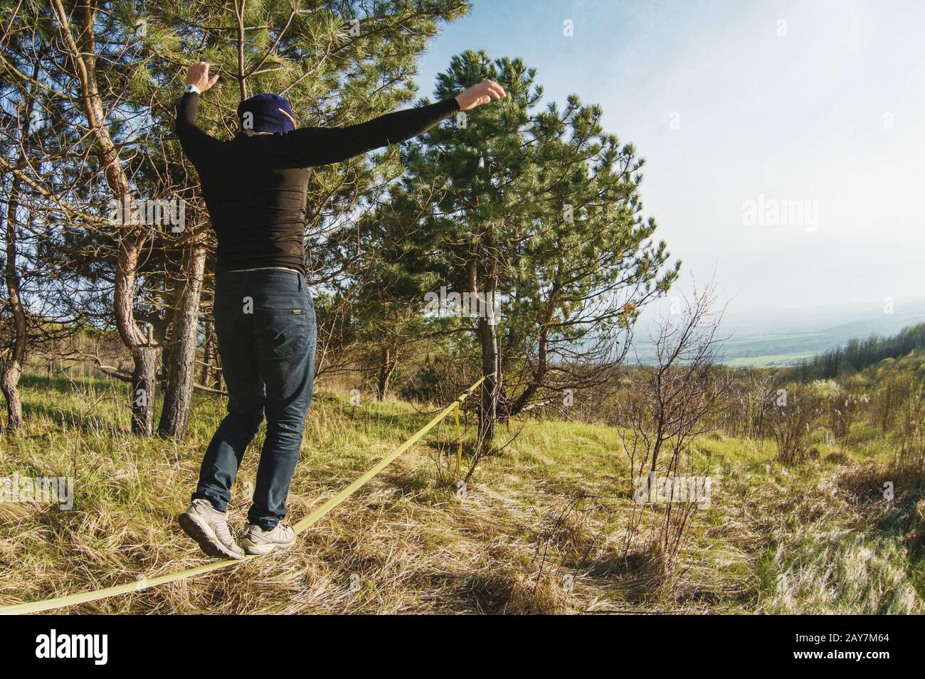 Man standing between two trees hi-res stock photography and images - Alamy