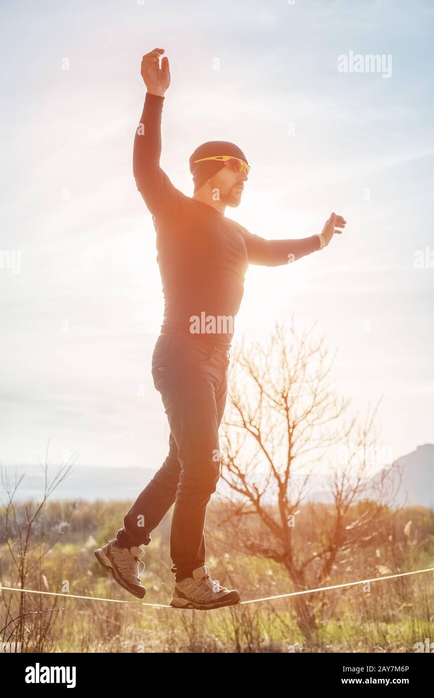 Man standing between two trees hi-res stock photography and images - Alamy