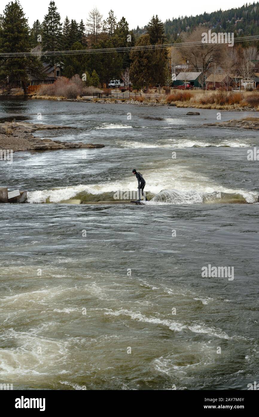 River surfing in the Deschutes River at the Bend White Water Rapid Park ...