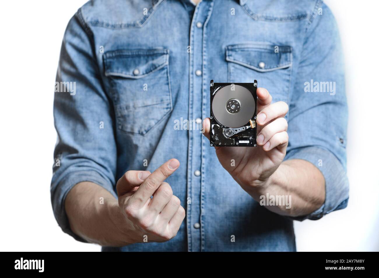 Man's hand holds a 2.5 inch hard drive. Isolated on white background ...