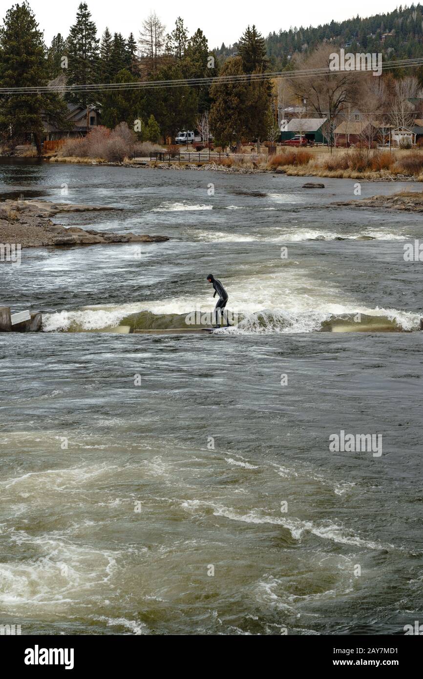 River surfing in the Deschutes River at the Bend White Water Rapid Park ...