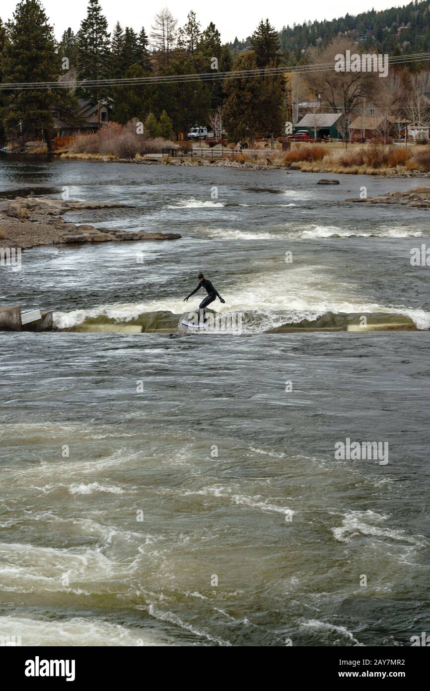 River surfing in the Deschutes River at the Bend White Water Rapid Park ...