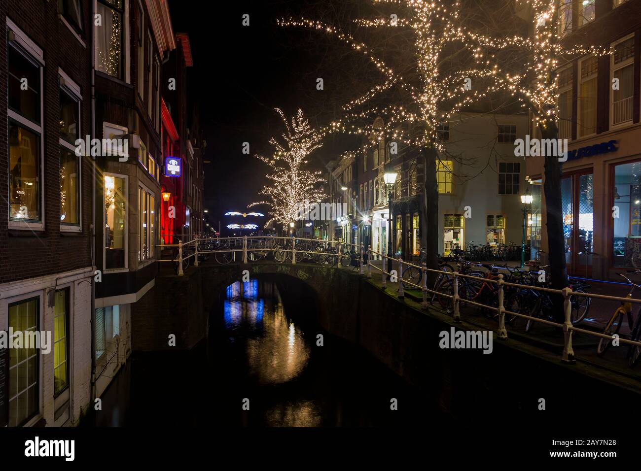 Delft, the Netherlands, Holland,January 18, 2020. Night view of a canal ...