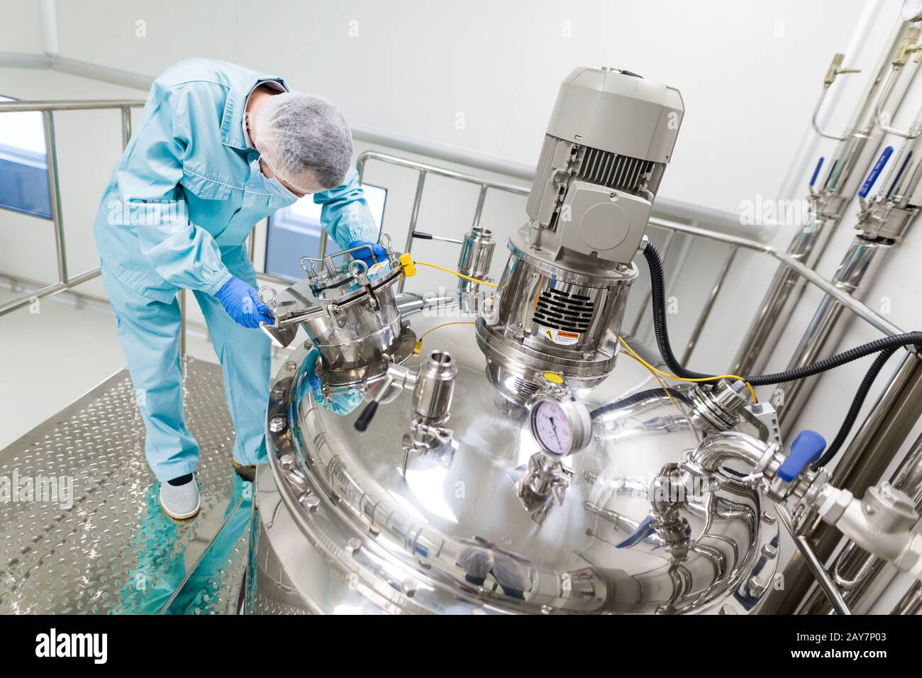scientist is working with steel tanks Stock Photo - Alamy