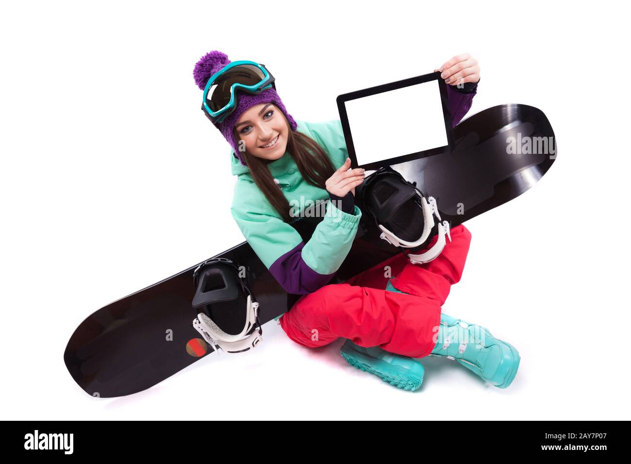 ski woman with snowboard showing tablet Stock Photo - Alamy