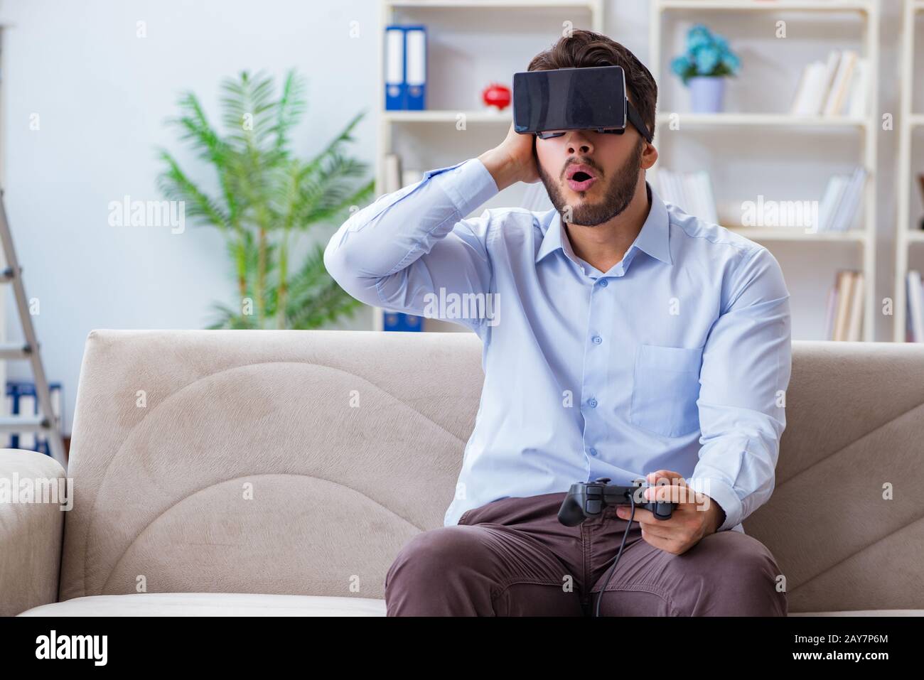 Student gamer playing games at home Stock Photo - Alamy