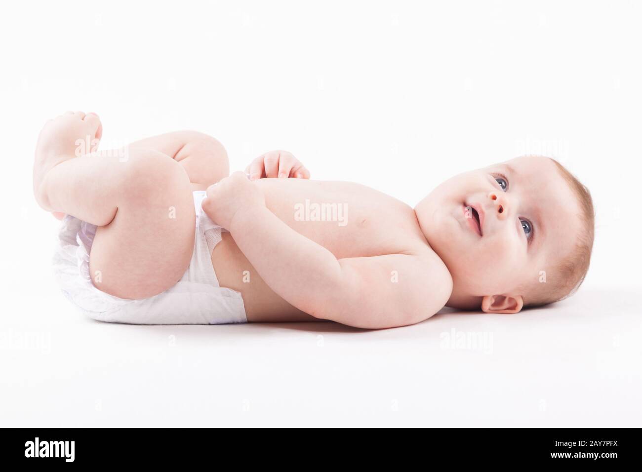 cute baby boy in diaper lies on back Stock Photo - Alamy