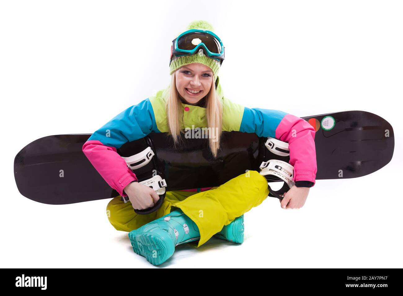 beauty woman in ski costume sit with snowboard crossed legs Stock Photo ...