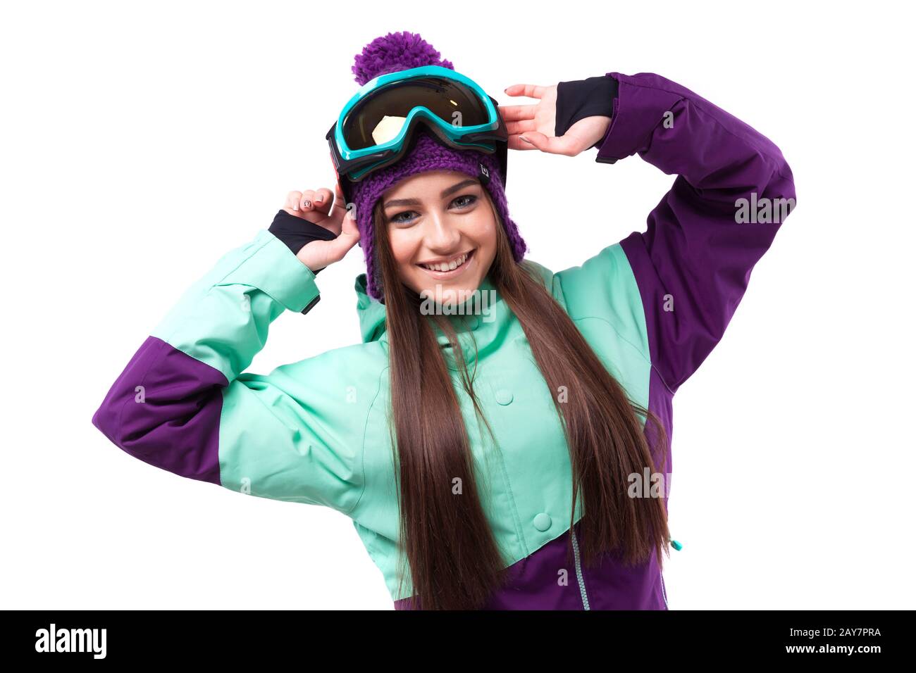 cheerful young pretty woman in purple ski coat and goggles Stock Photo ...