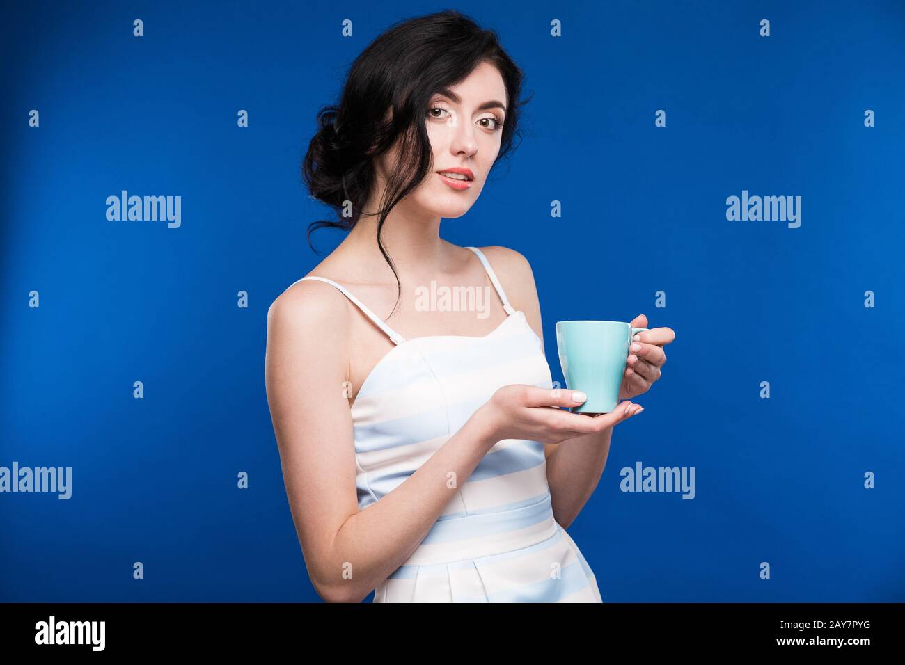 Girl with a cup Stock Photo - Alamy